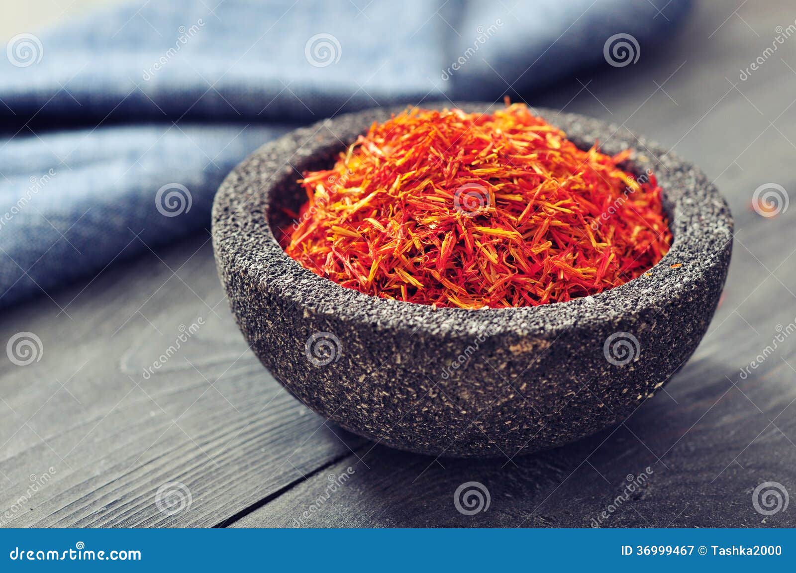 Saffron in stone bowl stock image. Image of intense, exotic - 36999467