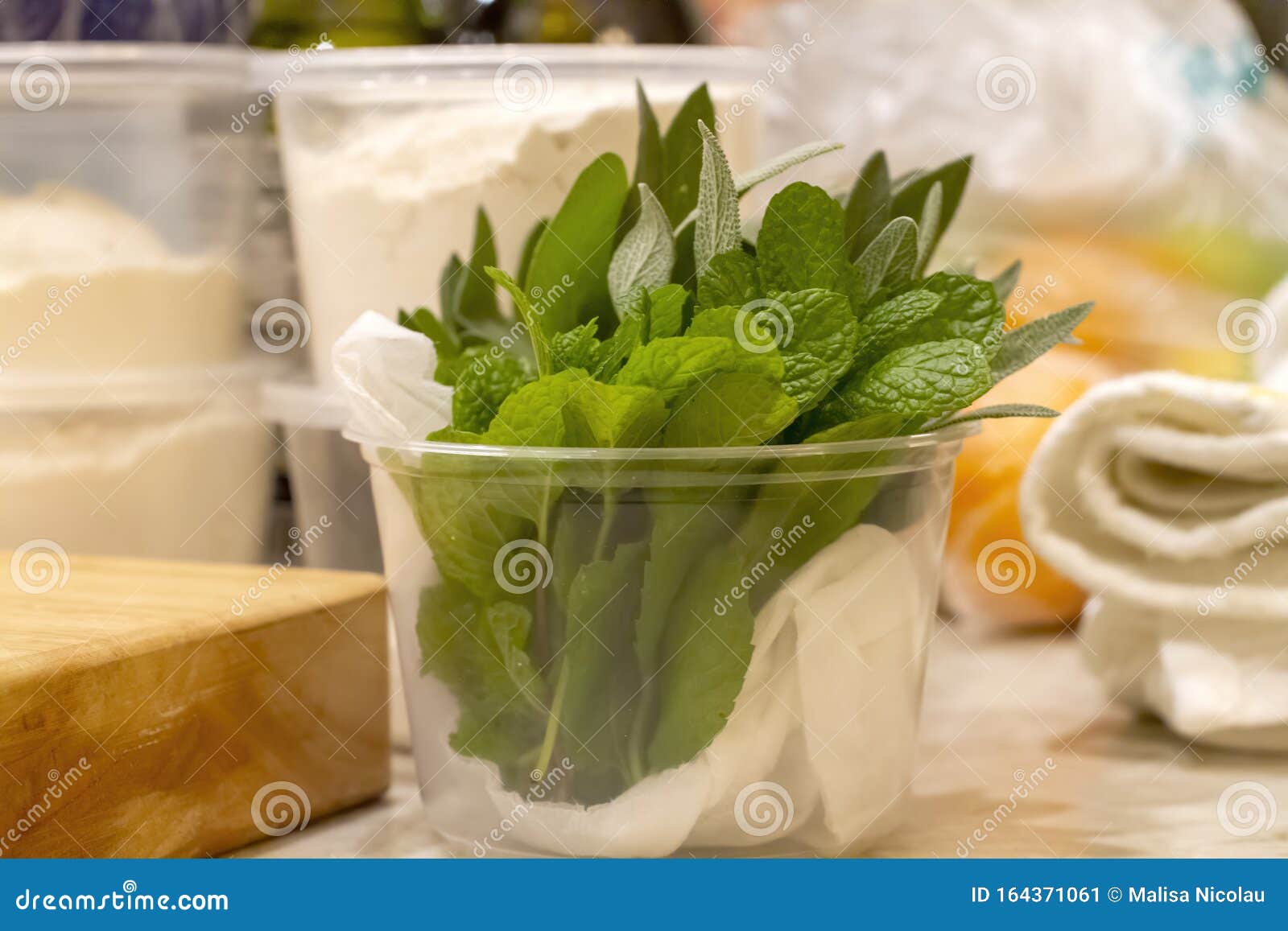 Sage Bunch in a Plastic Container on a Kitchen Counter Top Stock Image ...