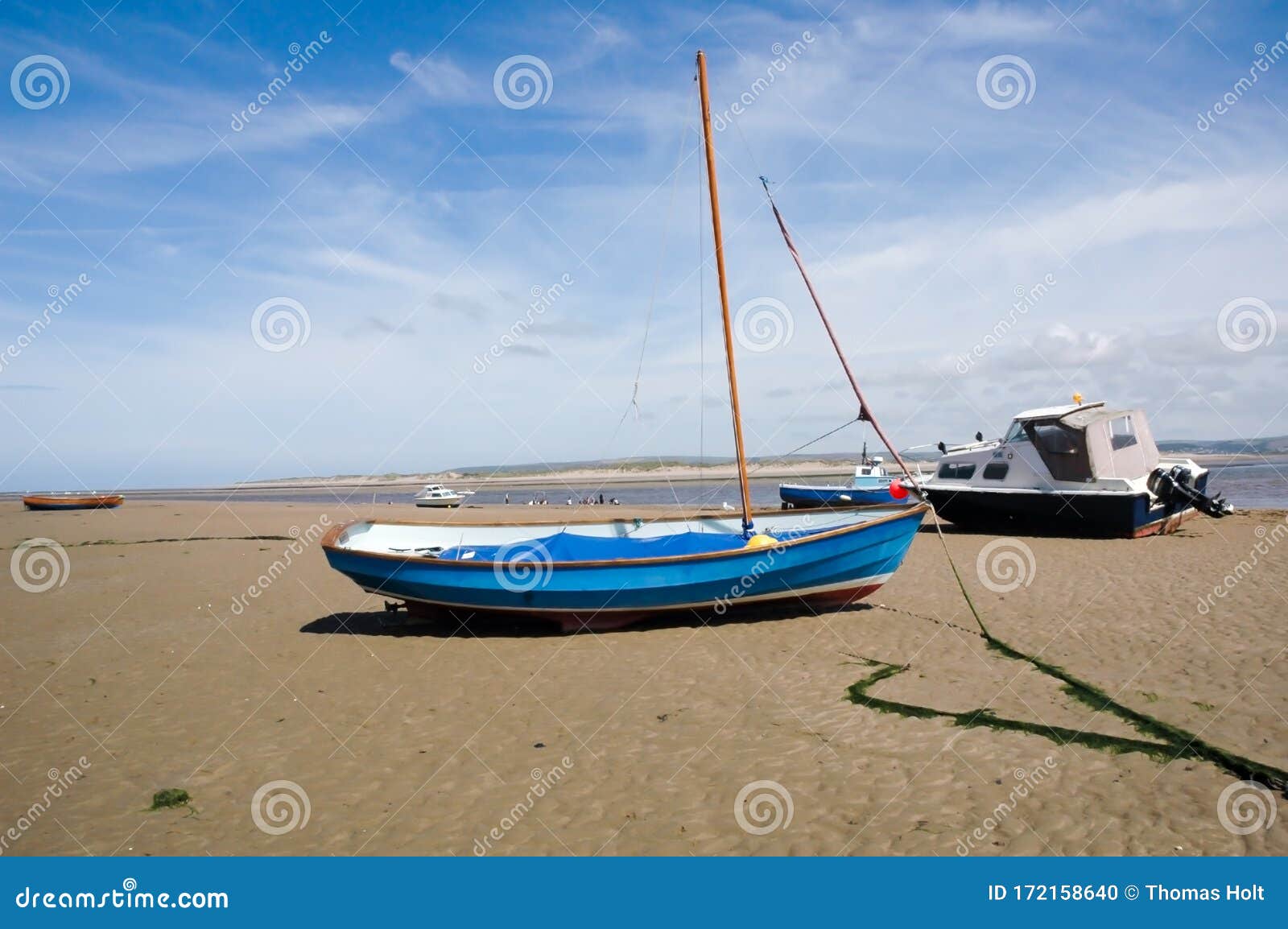 Sail Boat Moored with an Anchor on the Beach at Low Tide at Appledore ...