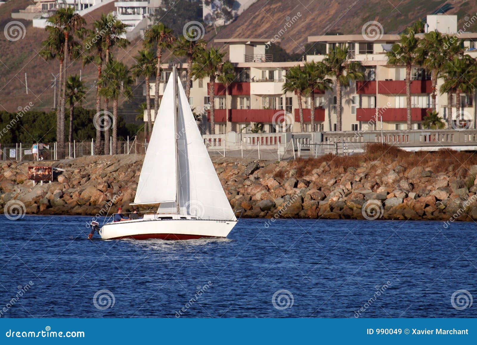 Sailboat along the coast stock image. Image of channel - 990049