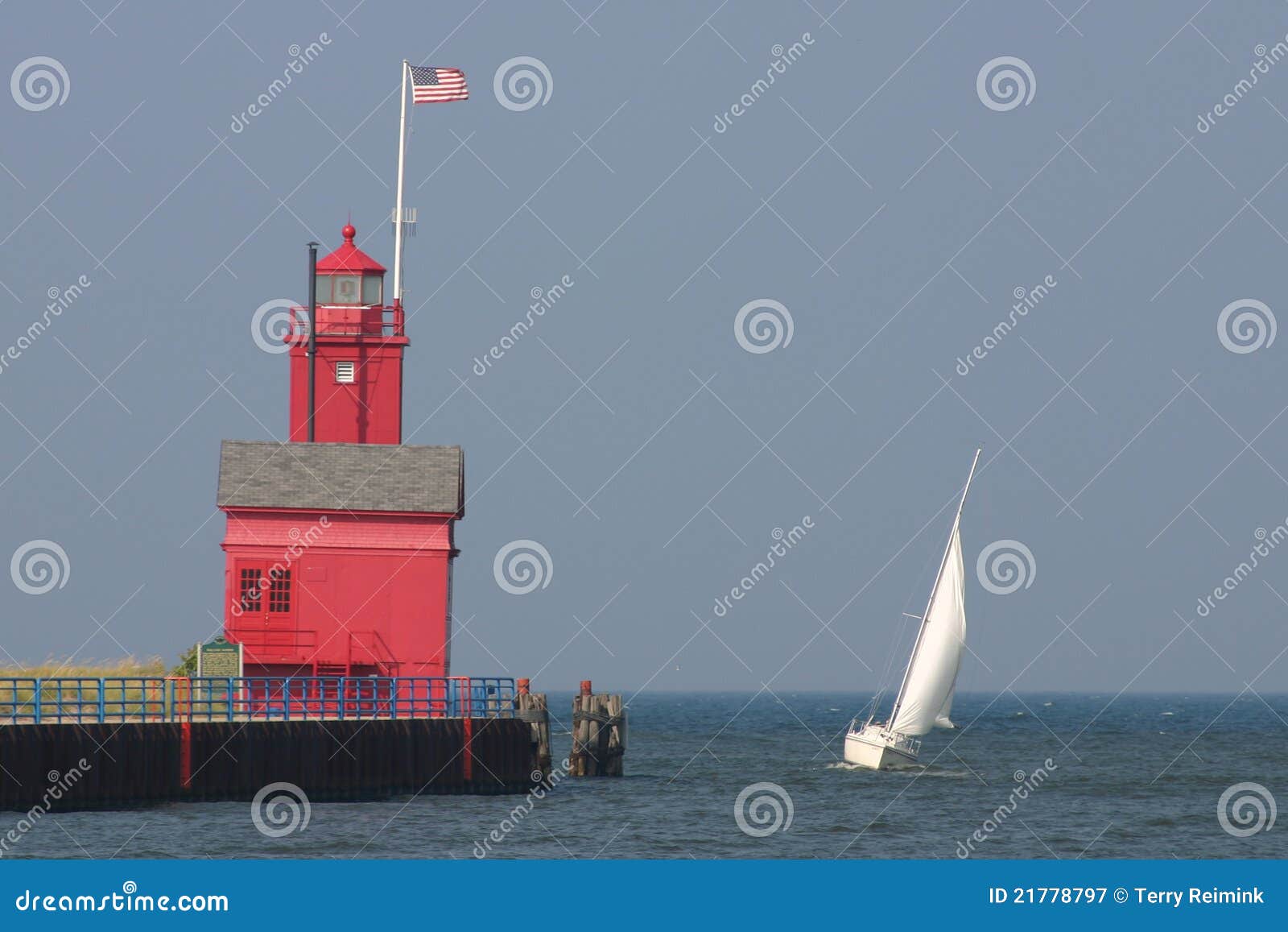 Sailboat and Big Red Lighthouse Stock Image - Image of water, michigan ...
