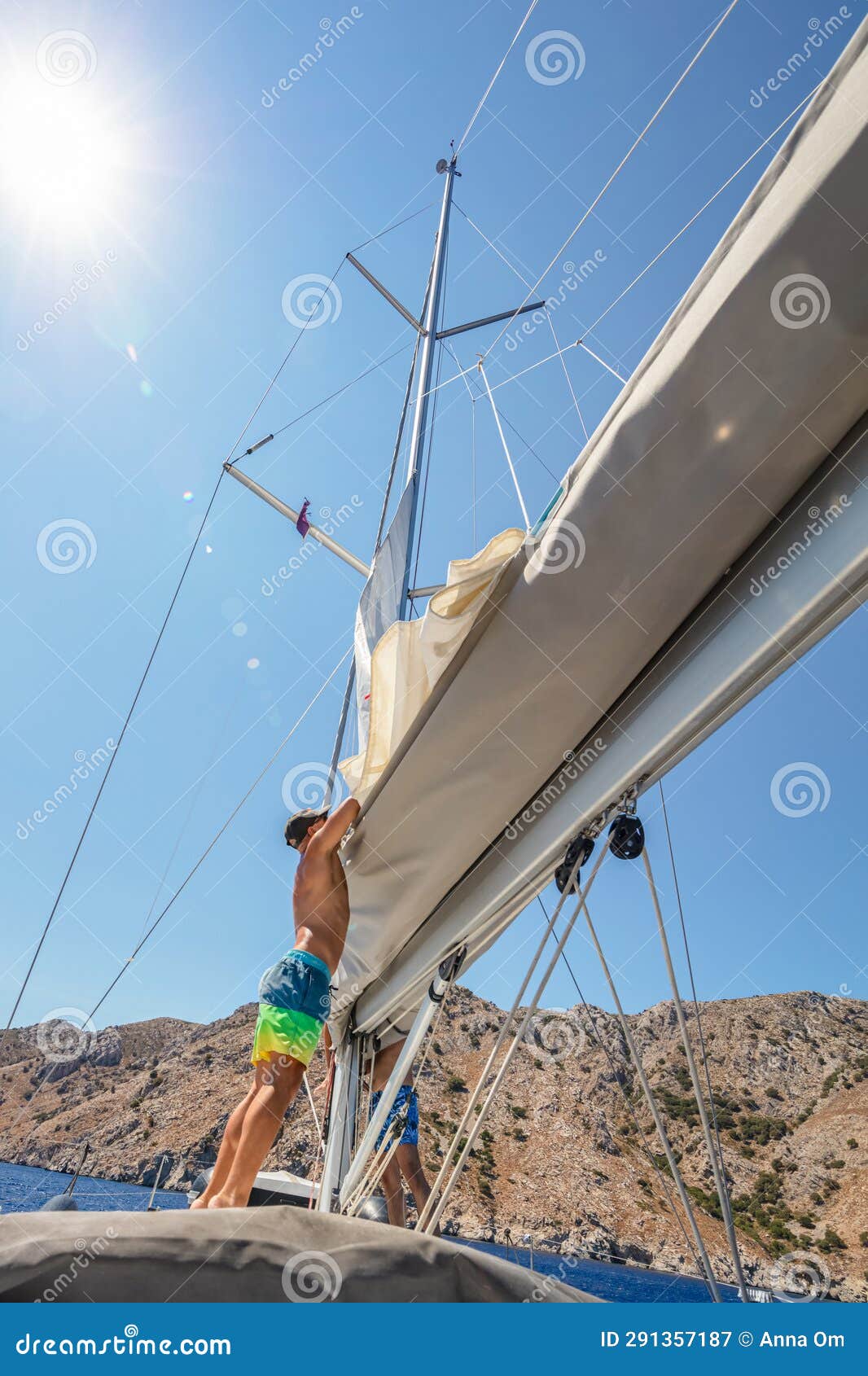Sailboat Crew Folding the Sail Stock Image - Image of holiday, regatta ...