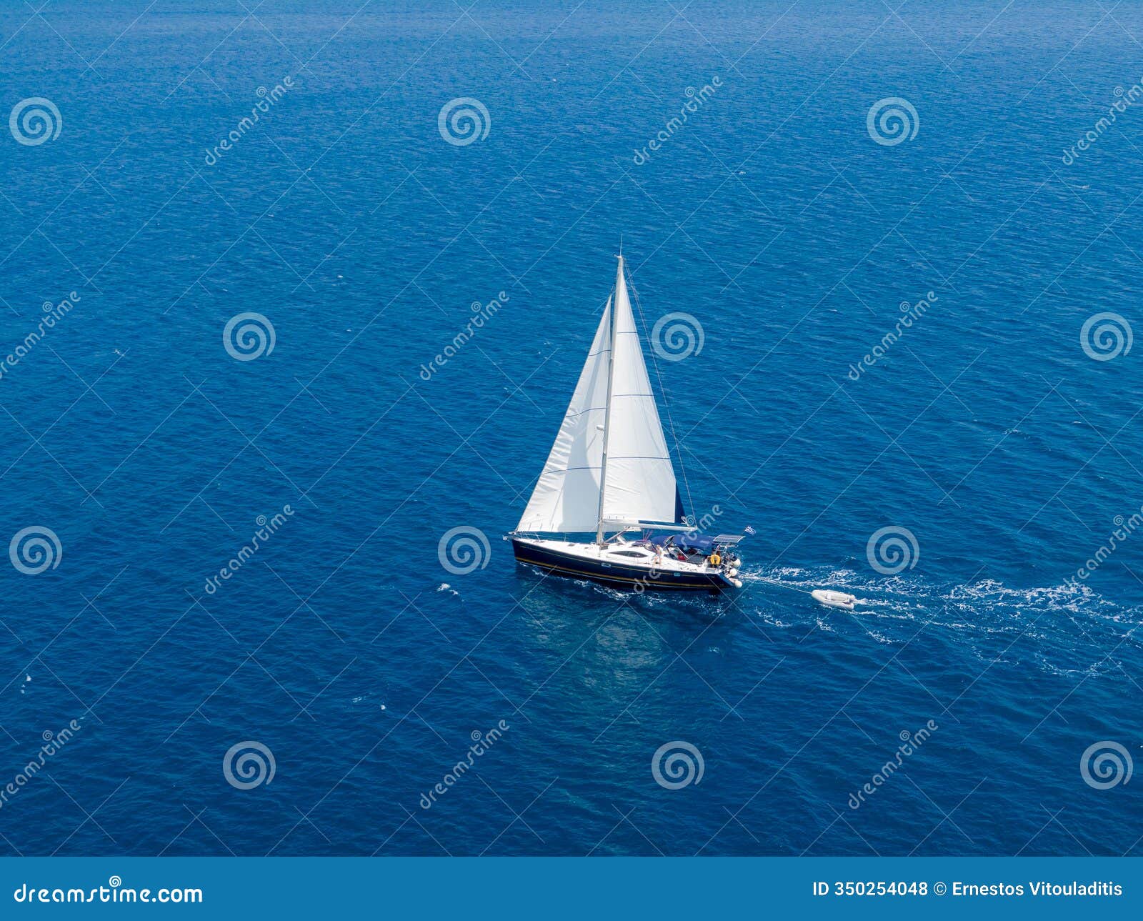 Sailboat Cruising on a Vast Blue Ocean Stock Photo - Image of wind ...