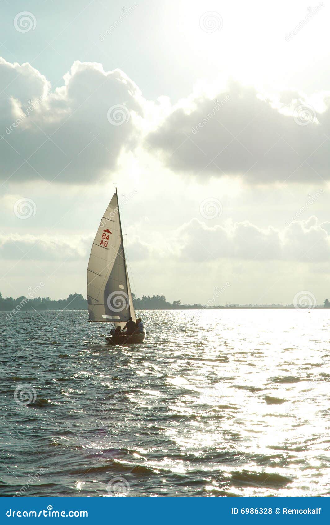 Sailboat on lake stock photo. Image of sunlit, water, white - 6986328