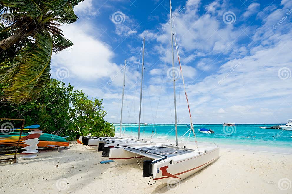 Sailboat Laying on the Beach Stock Image - Image of paradise, sailing ...