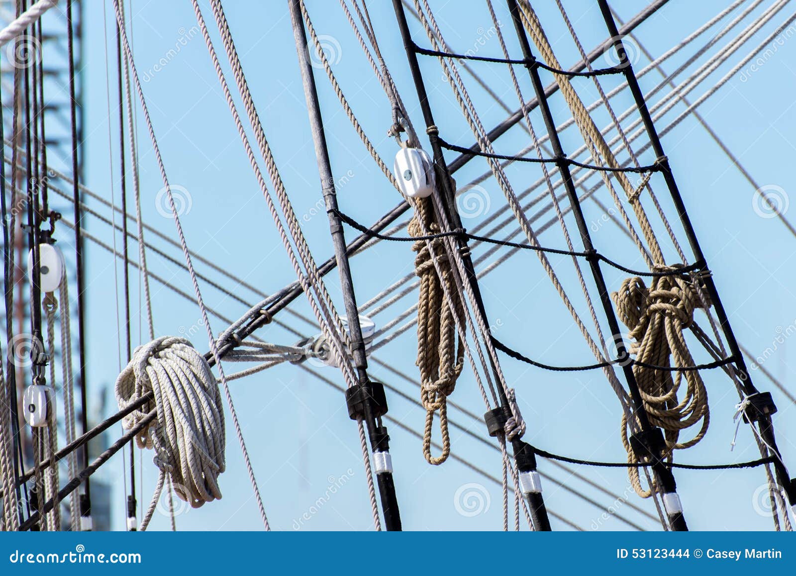Sailboat Masts, Rigging and Rolled Up Sails Stock Photo - Image of ship ...