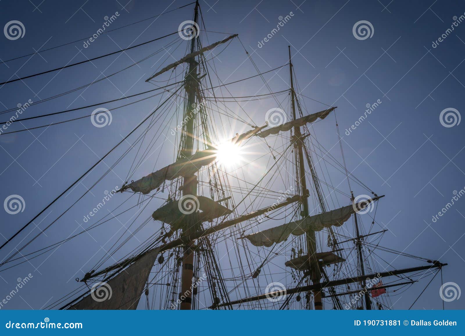 Sailboat Masts with Sunburst in the Background Stock Image - Image of ...