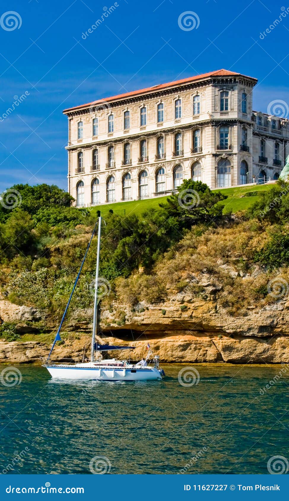 Sailboat Passing Under Cliff Stock Image - Image of landscape, river ...