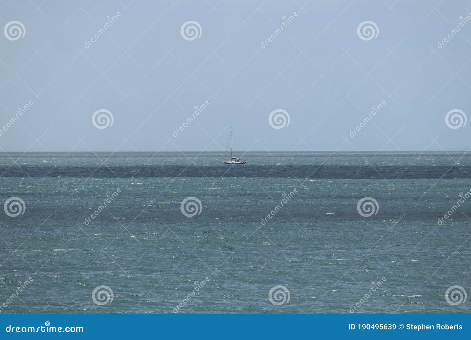 Sailboat Riding The Ocean Waves At Sunset Royalty-Free Stock Image ...
