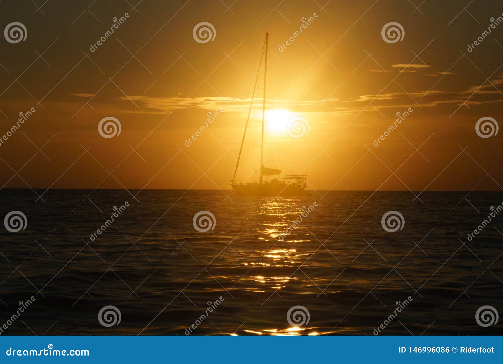 Sailboat Sailing on the Horizon during Sunset Stock Photo - Image of ...