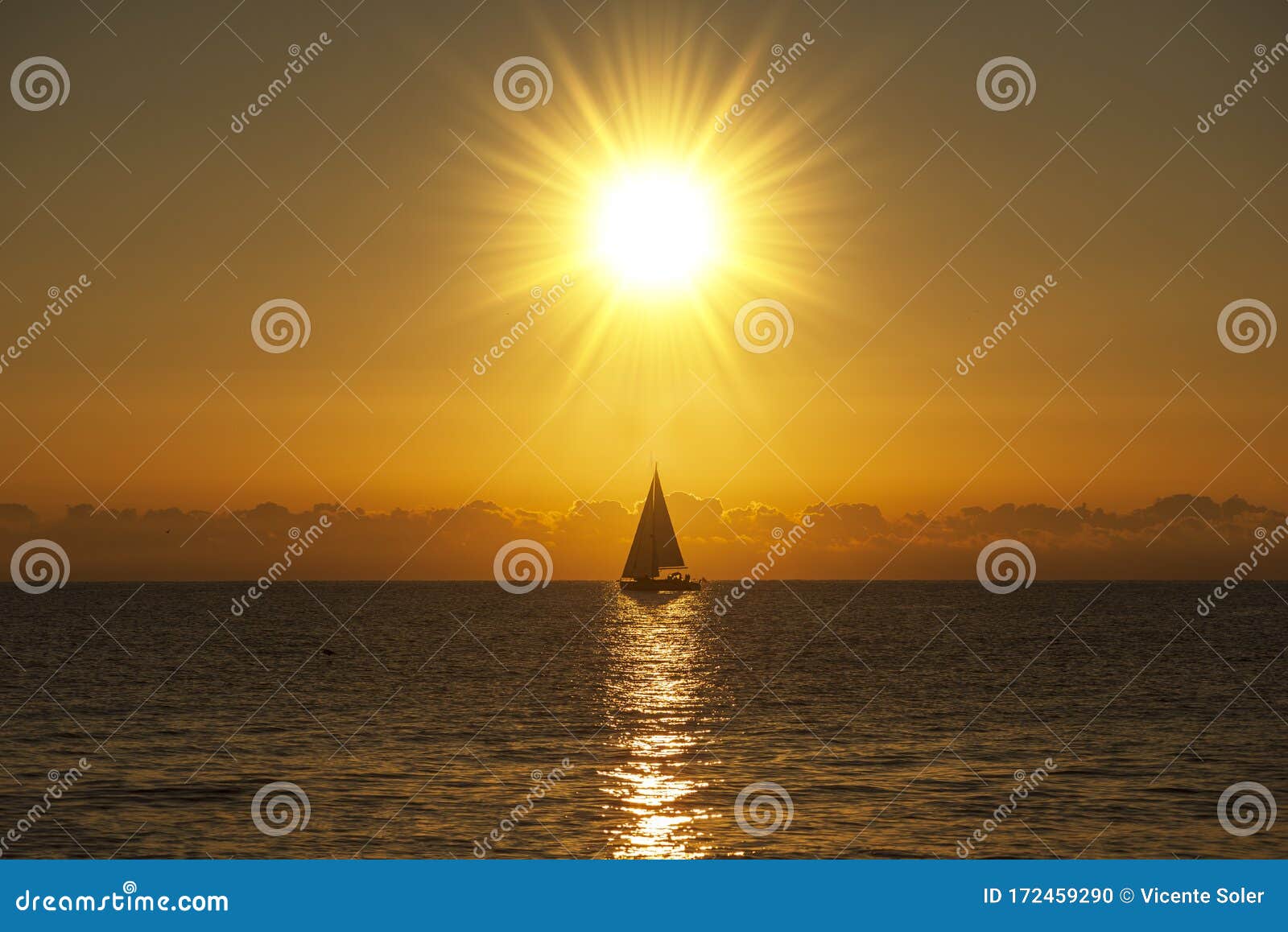 A Sailboat Sailing with the Sunrise Sun Stock Photo - Image of freedom ...
