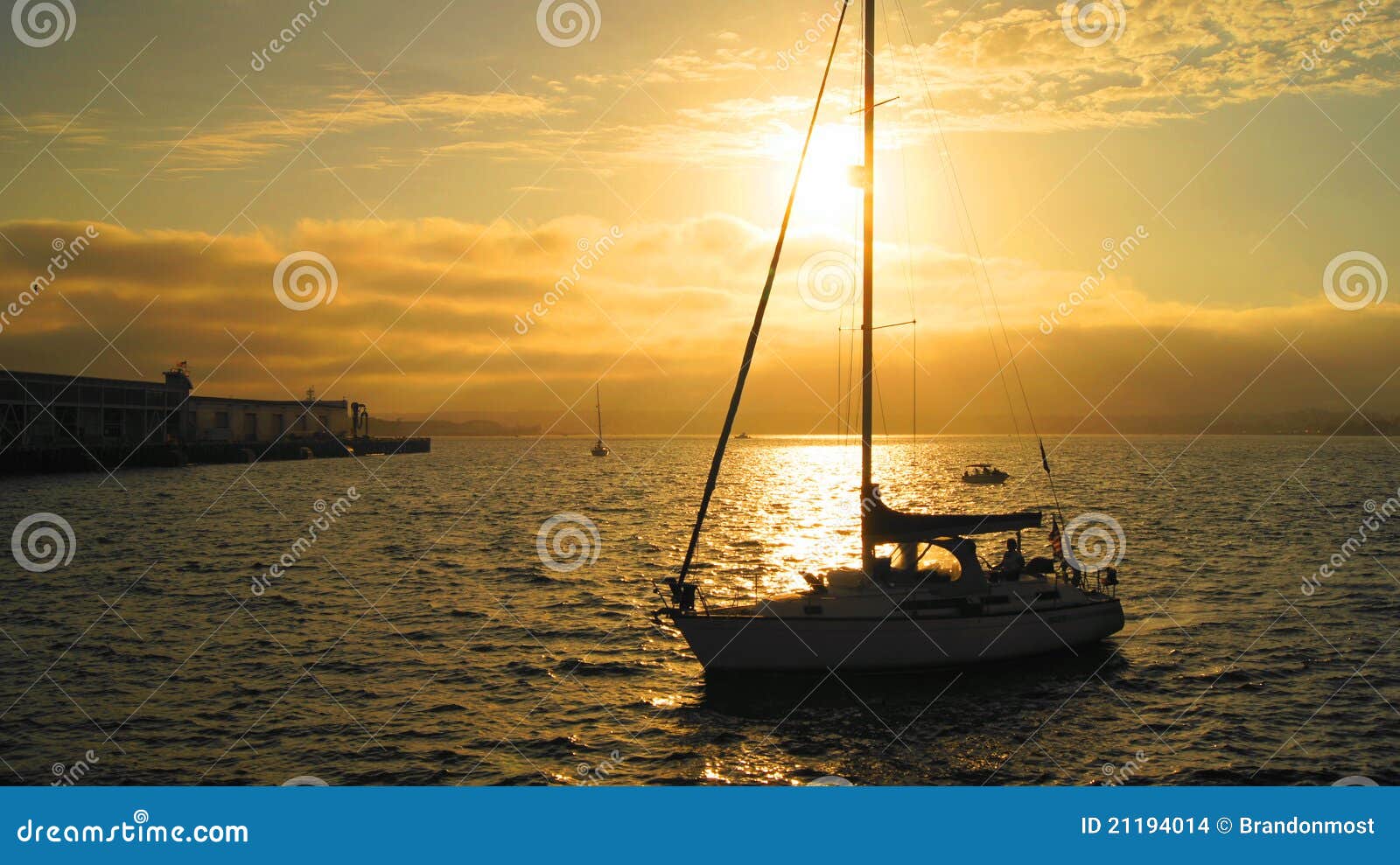 Sailboat at sunset stock photo. Image of ocean, sails - 21194014