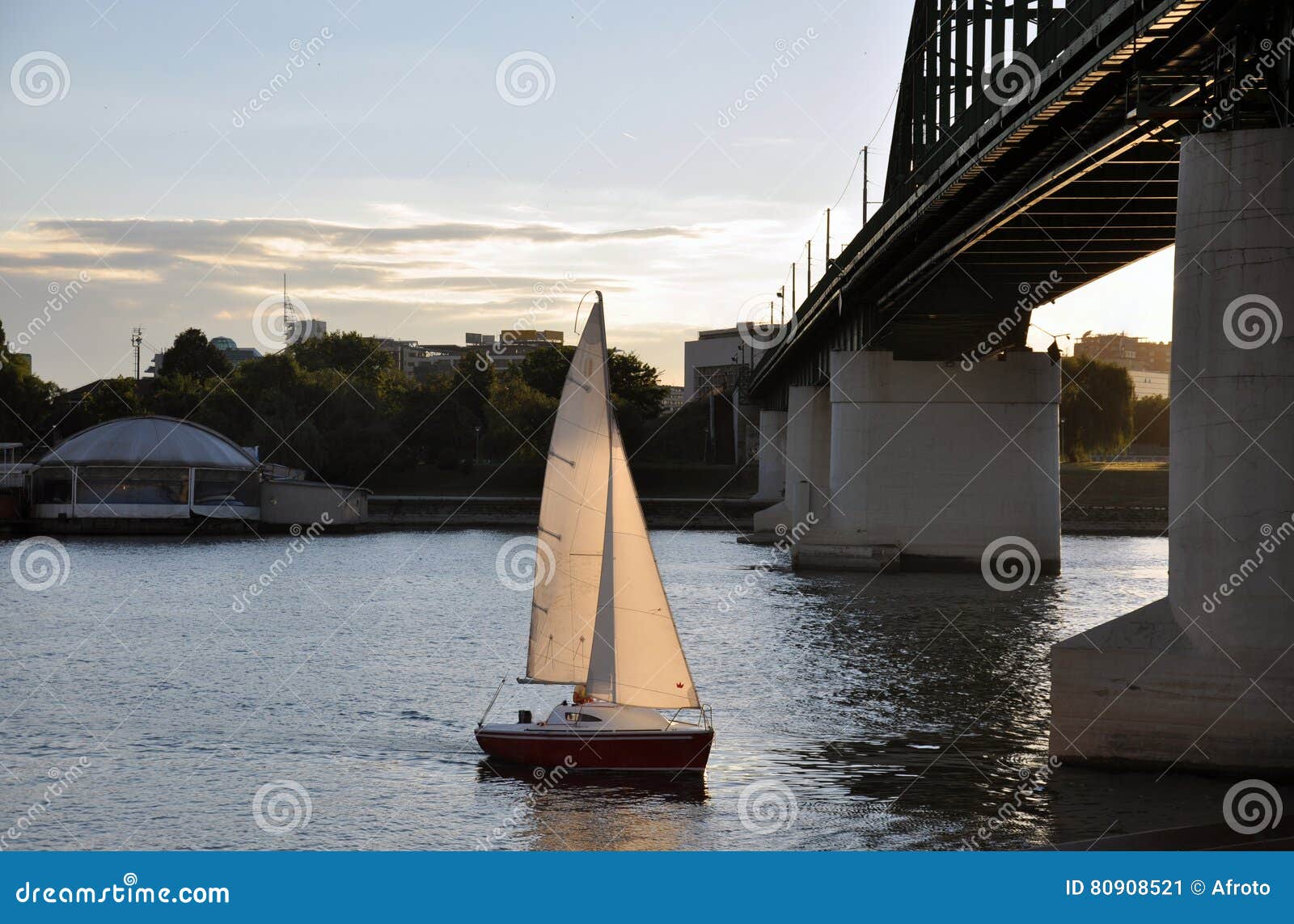 Sailboat under the bridge stock image. Image of water - 80908521