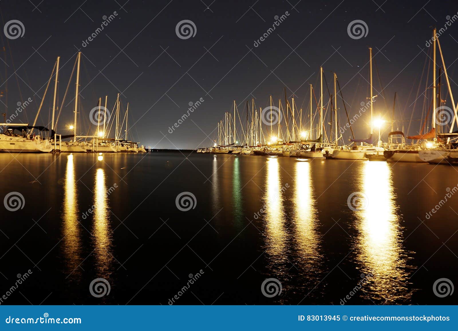 Sailboats Illuminated In Harbor Picture. Image: 83013945