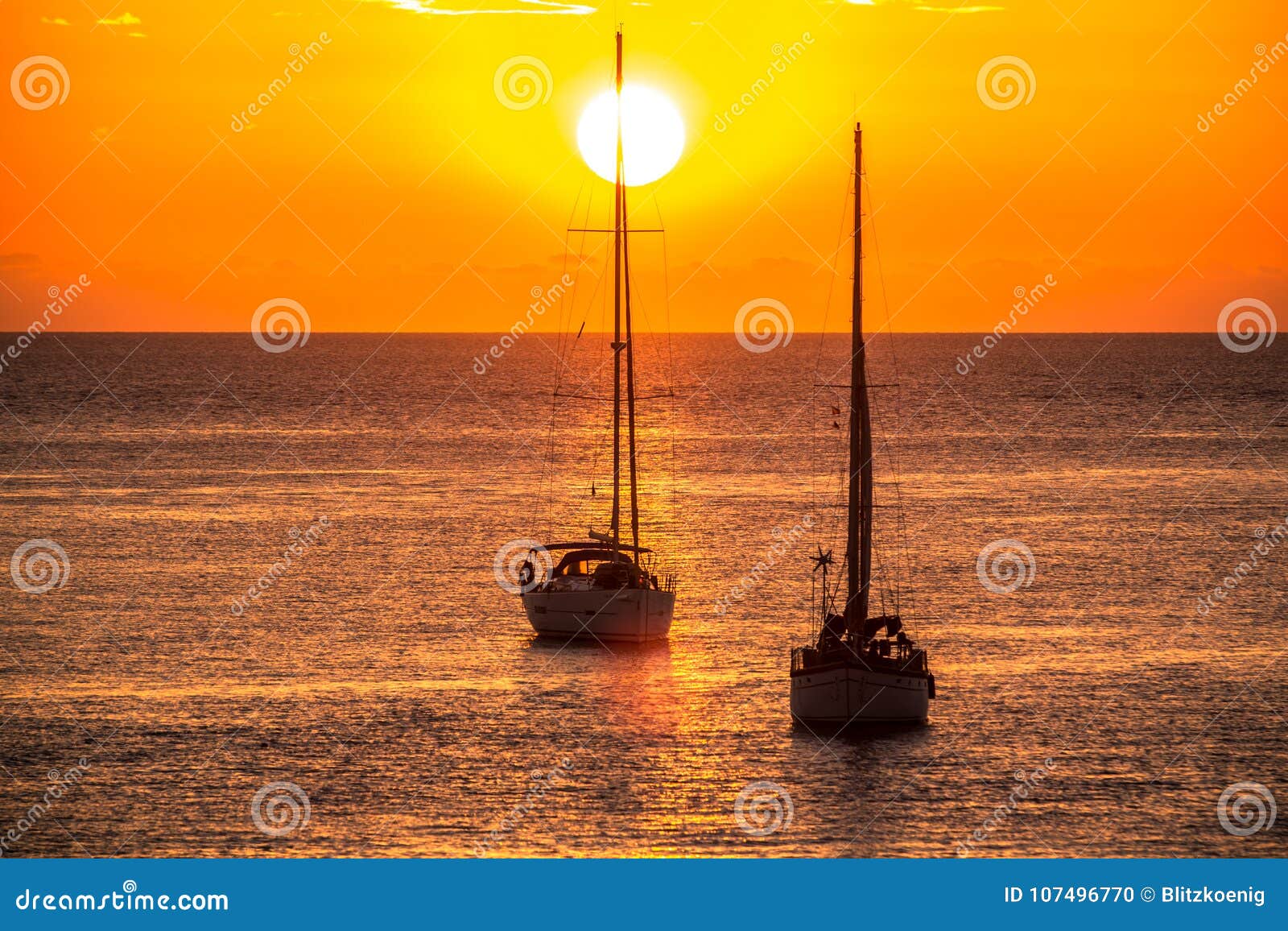 Sailboats at sunset stock photo. Image of dramatic, outdoors - 107496770