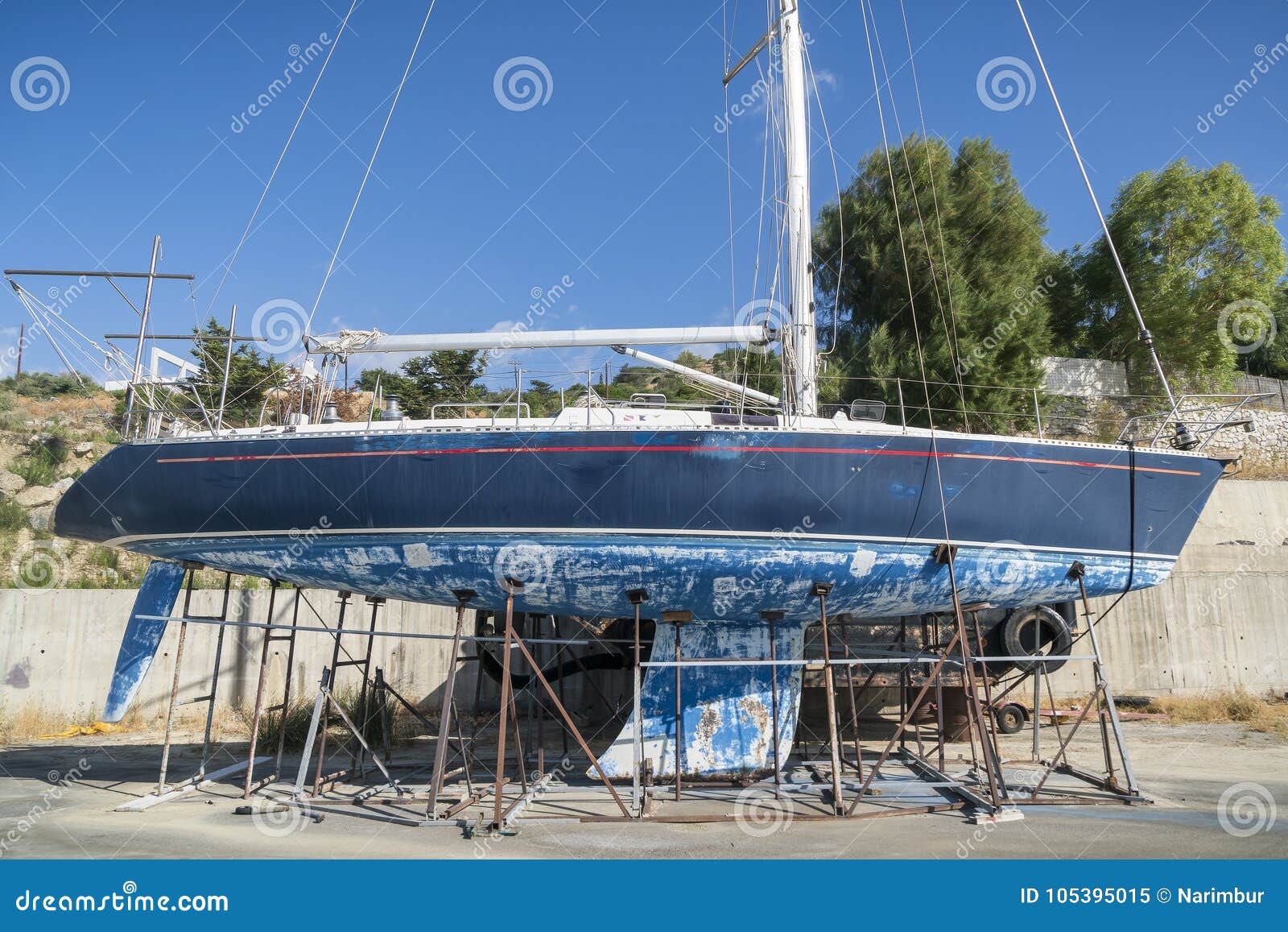 Sailing boat in dry dock stock image. Image of beached - 105395015