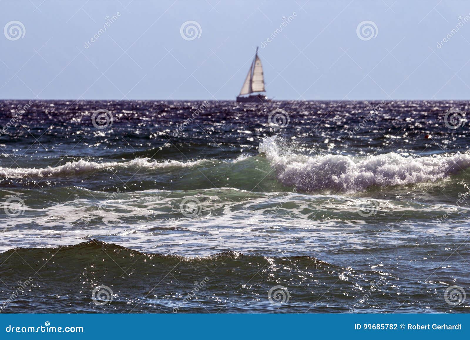 Sailing Boat with Sunlit Waves Stock Photo - Image of sailboat, sail ...