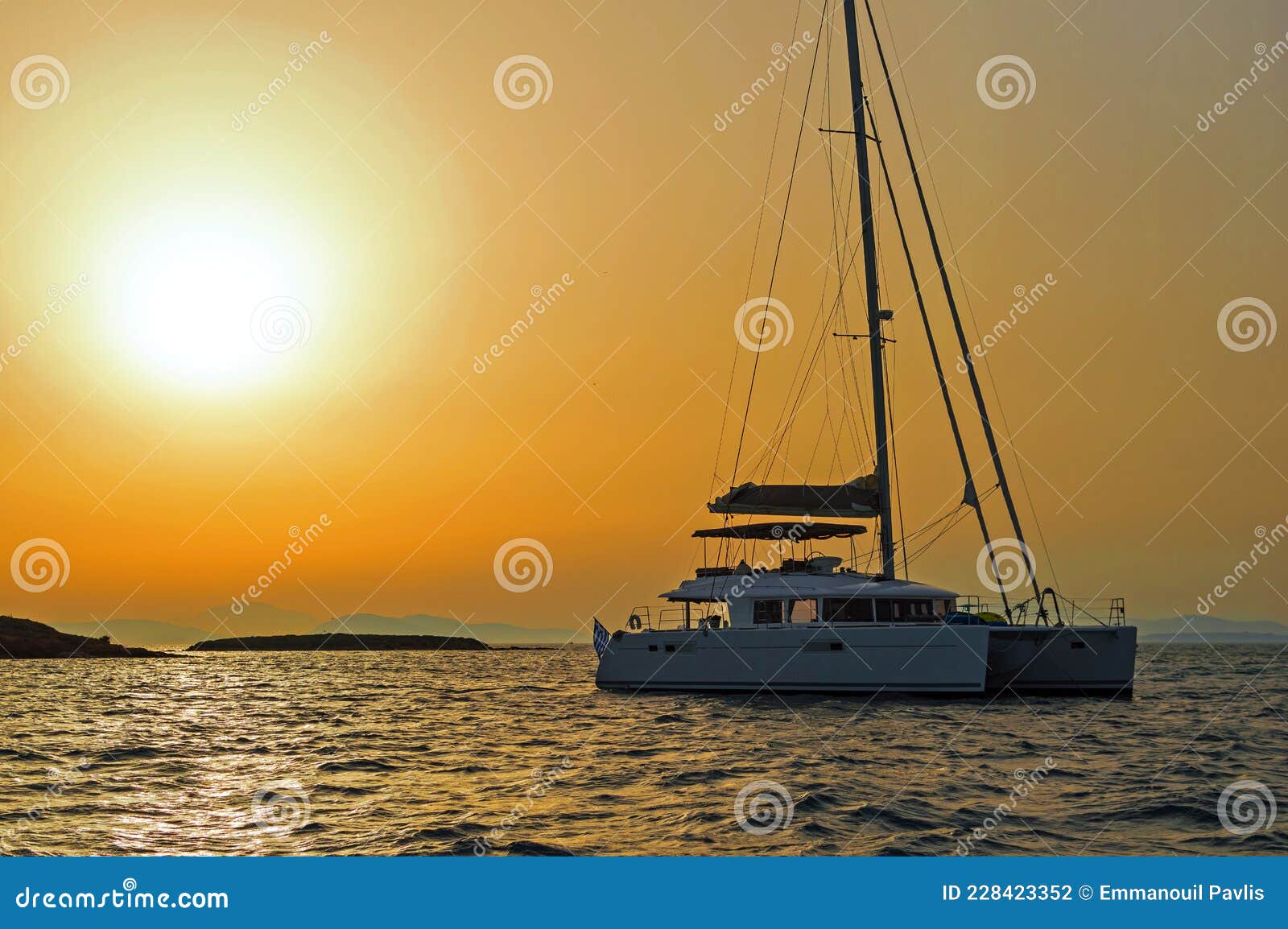Sailing Catamaran at the Sunset Stock Photo - Image of aegean, greece ...