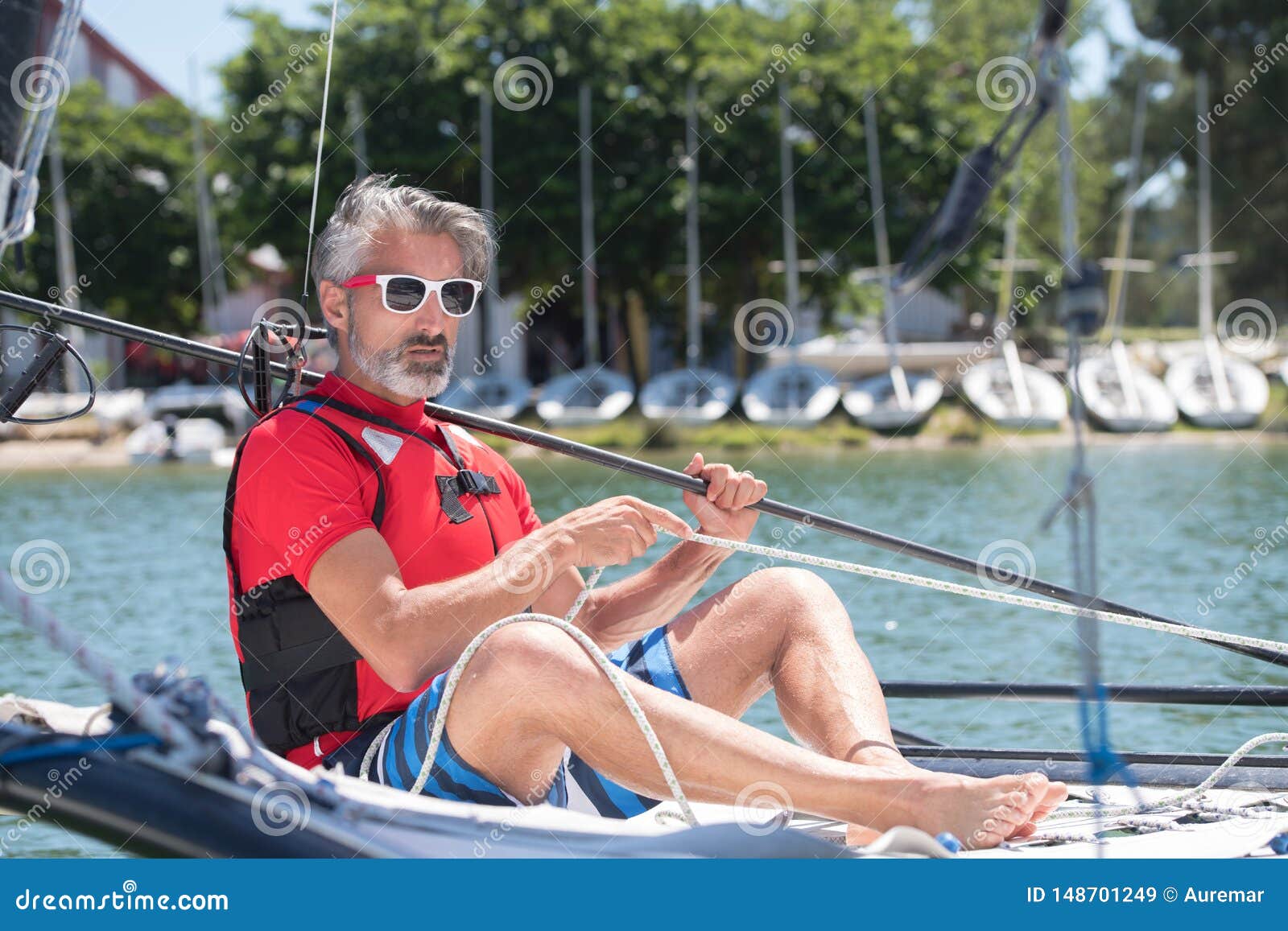 Sailing man on boat stock image. Image of sunlight, senior - 148701249