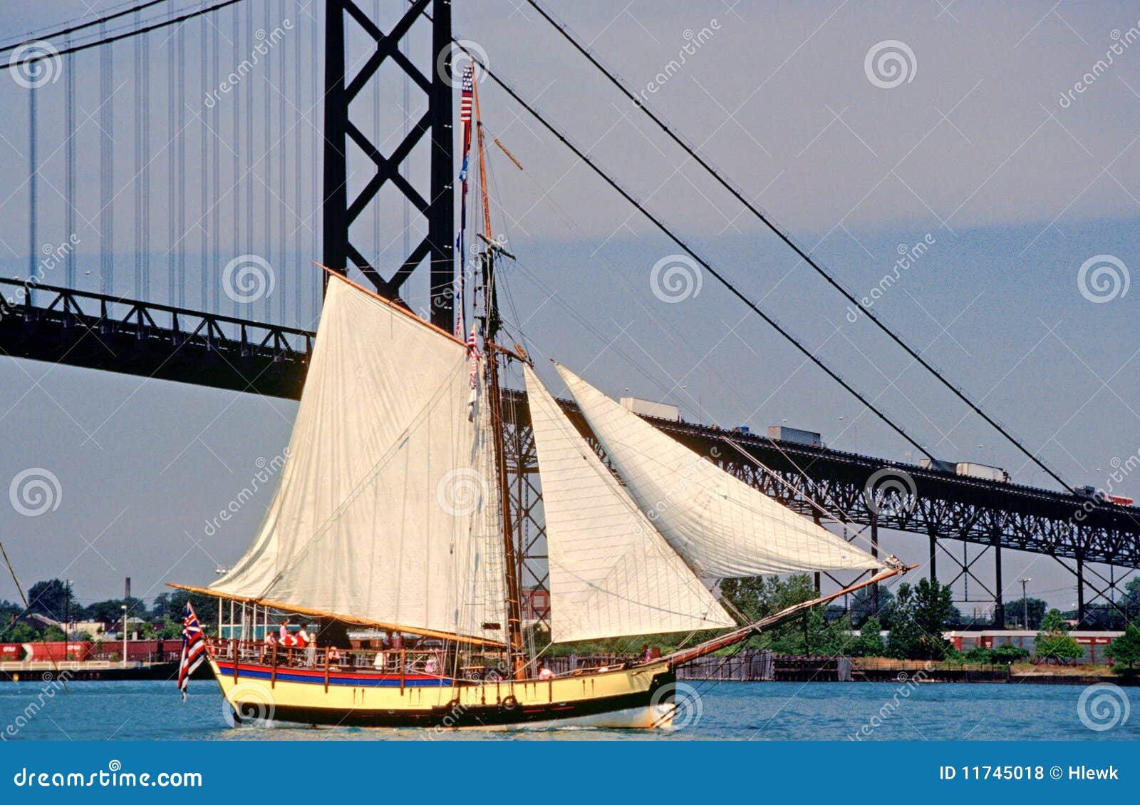 Sailing Ship on a River Passing a Bridge Stock Photo - Image of ...