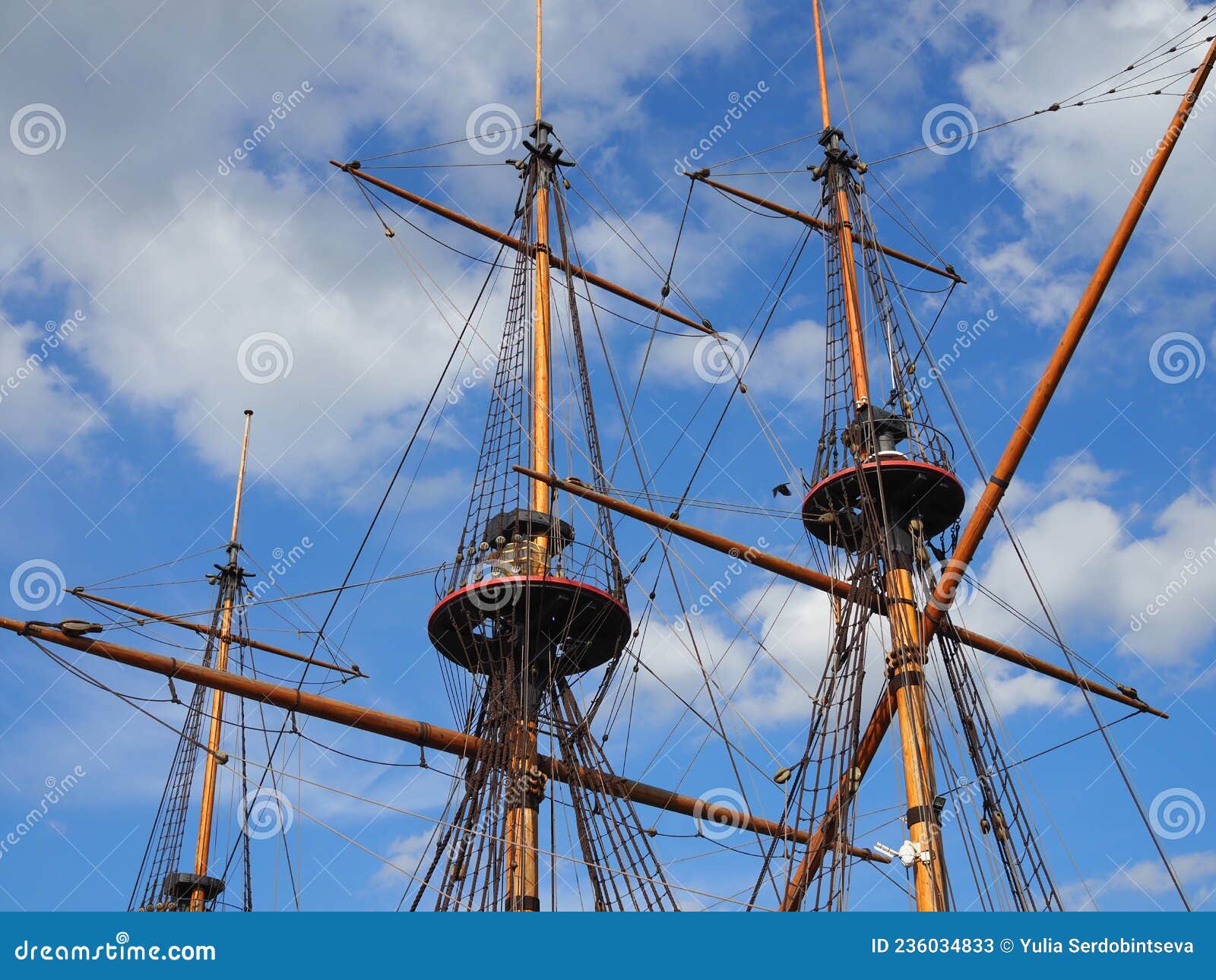 Sailing Ship with Tall Masts Against a Blue Sky Stock Image - Image of ...