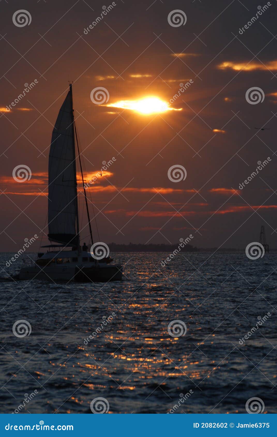 Sailing at sunset stock photo. Image of sunset, dusk, ocean - 2082602