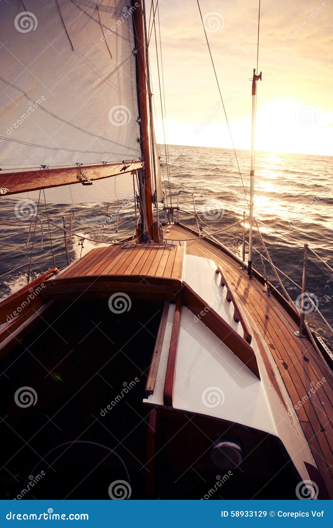Sailing towards the sun stock image. Image of sunset - 58933129