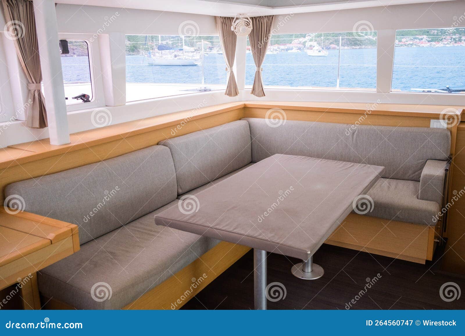 Sailing Yacht Interior with the Sea and Ships in the Background Stock ...