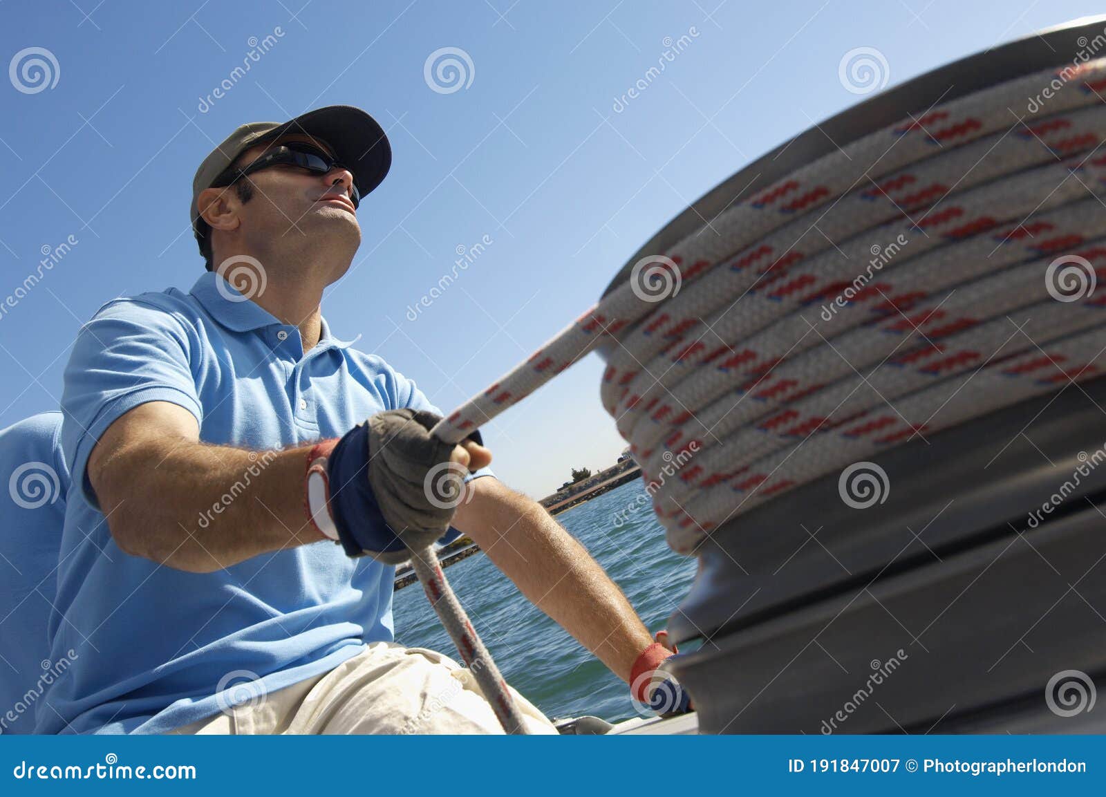 Sailor Adjusting Rope on Boat Stock Image - Image of outdoor, ship ...