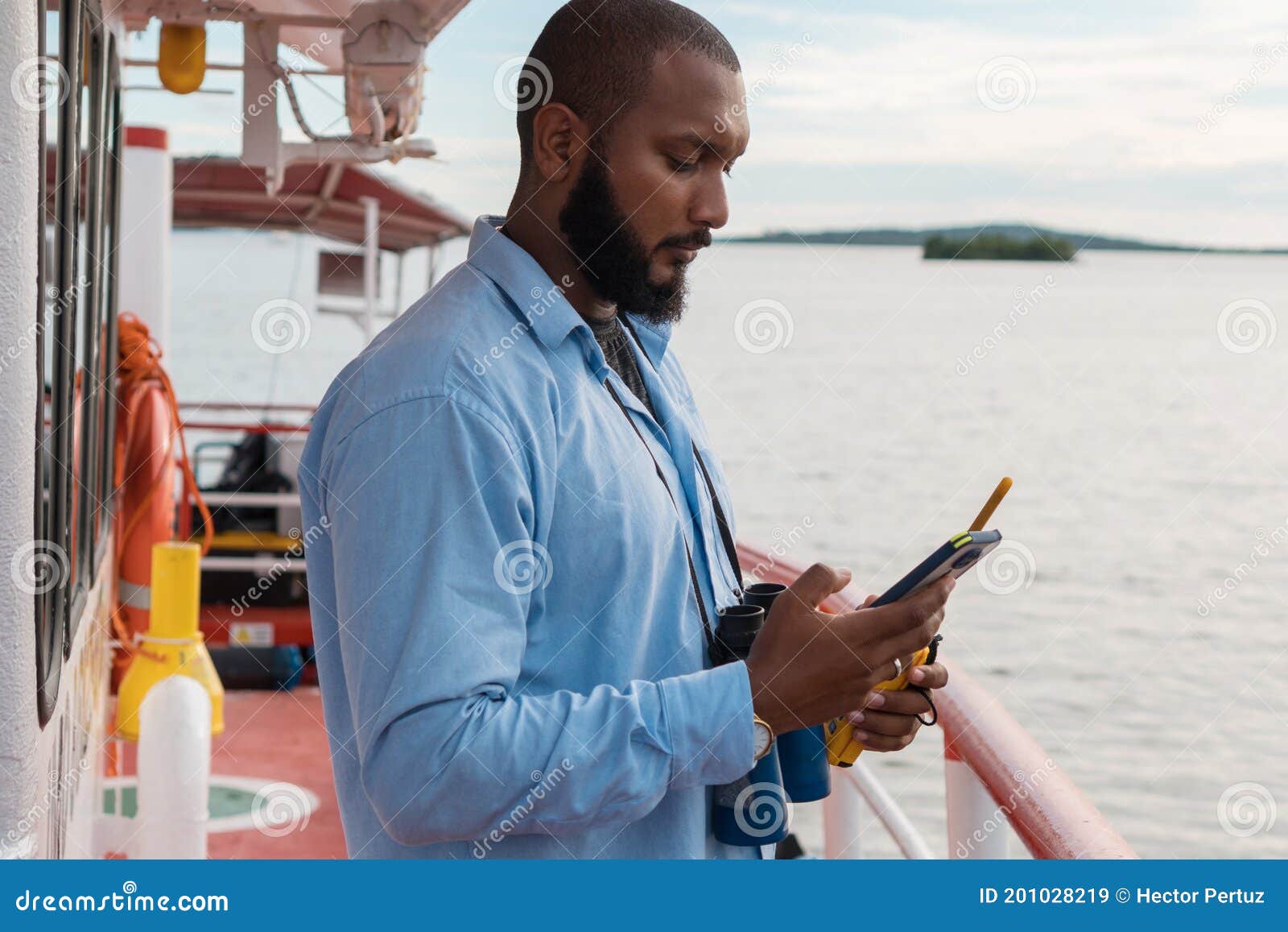 Sailor on Deck Checking His Phone. Boat with a Crew Member Using His ...