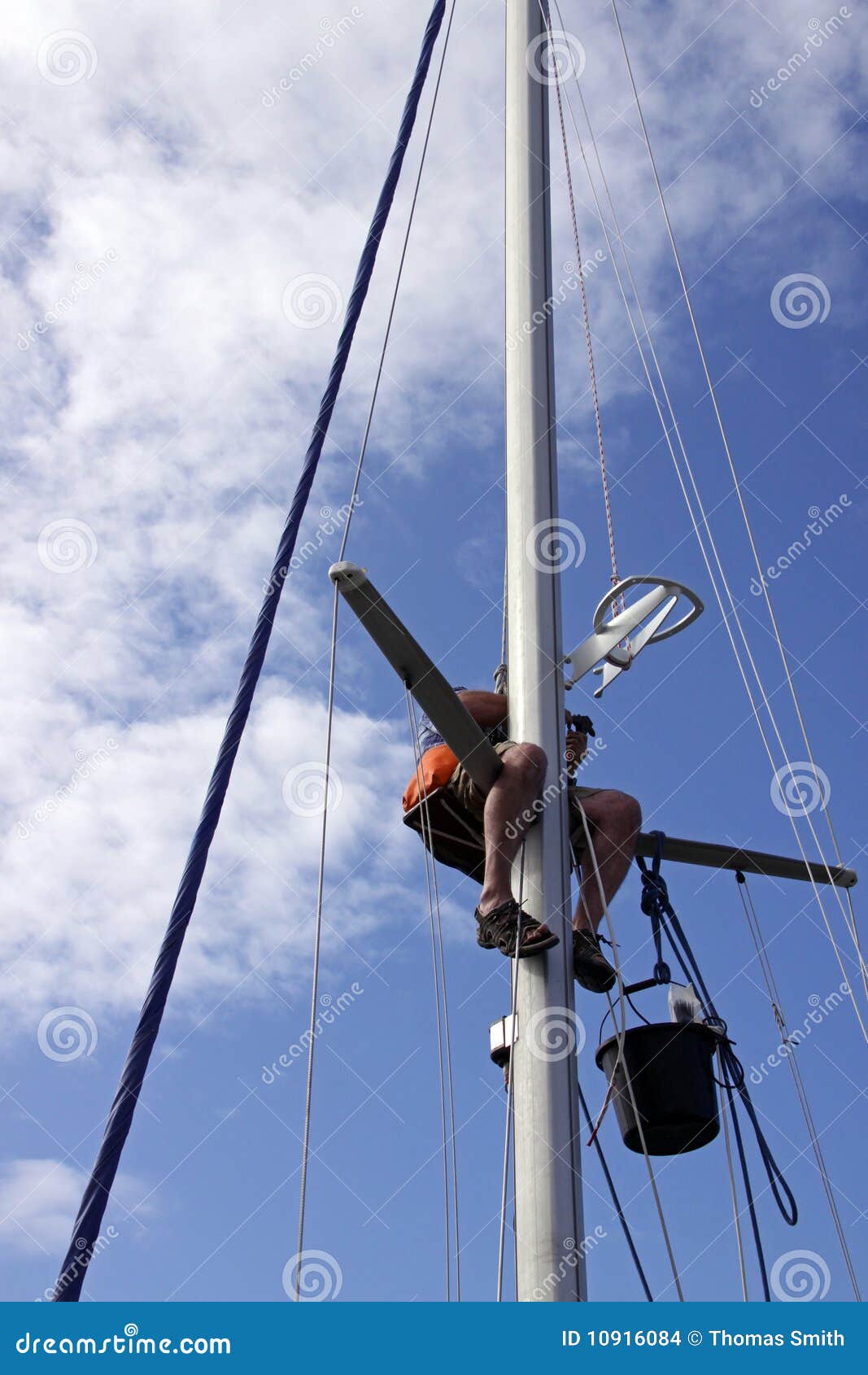 A sailor fixing a mast stock photo. Image of aqua, coast - 10916084