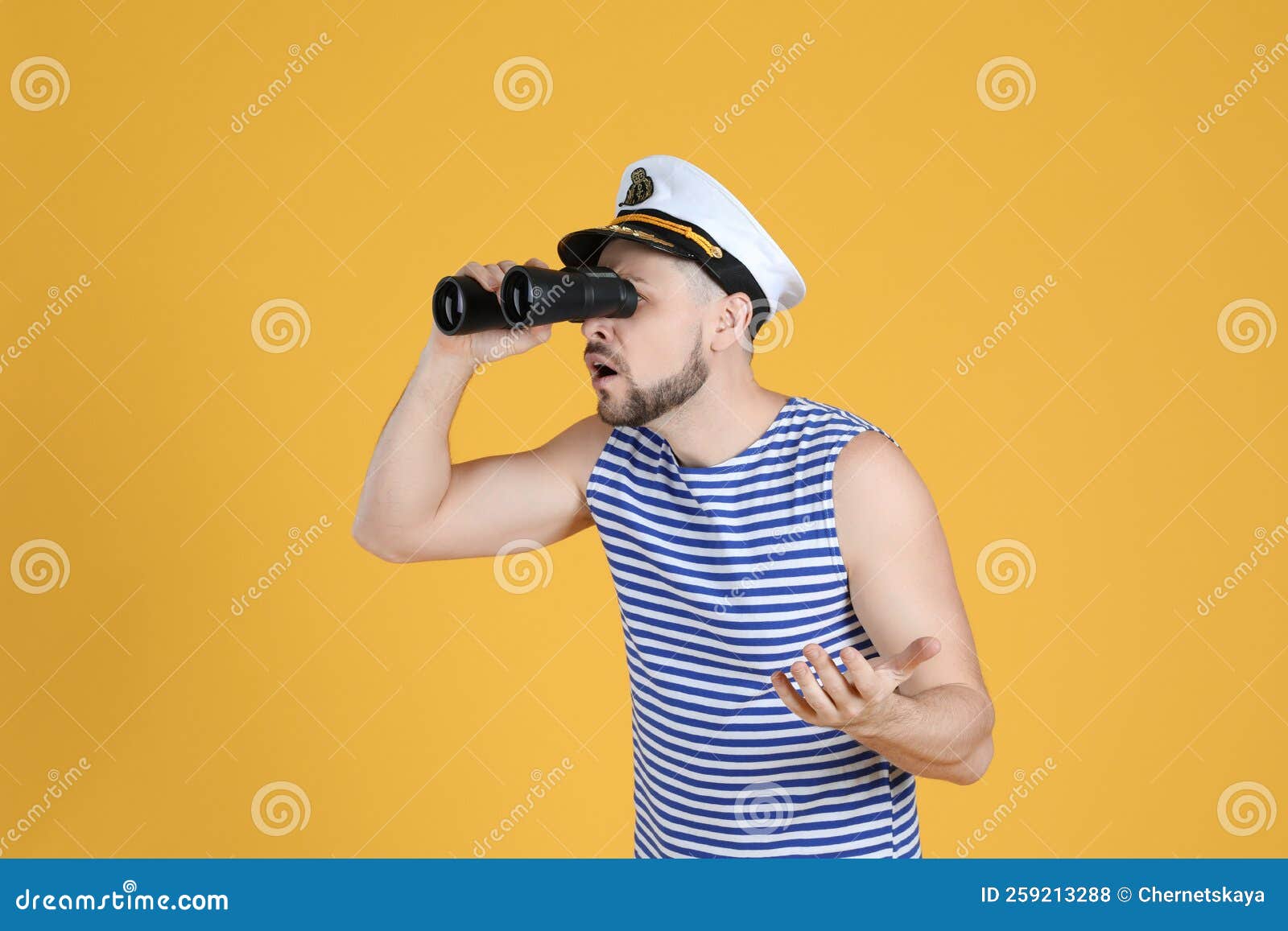 Sailor Looking through Binoculars on Yellow Background Stock Photo ...