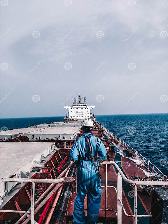 A Sailor Standing in the Main Deck of the Bulk Carrier Ship Editorial ...