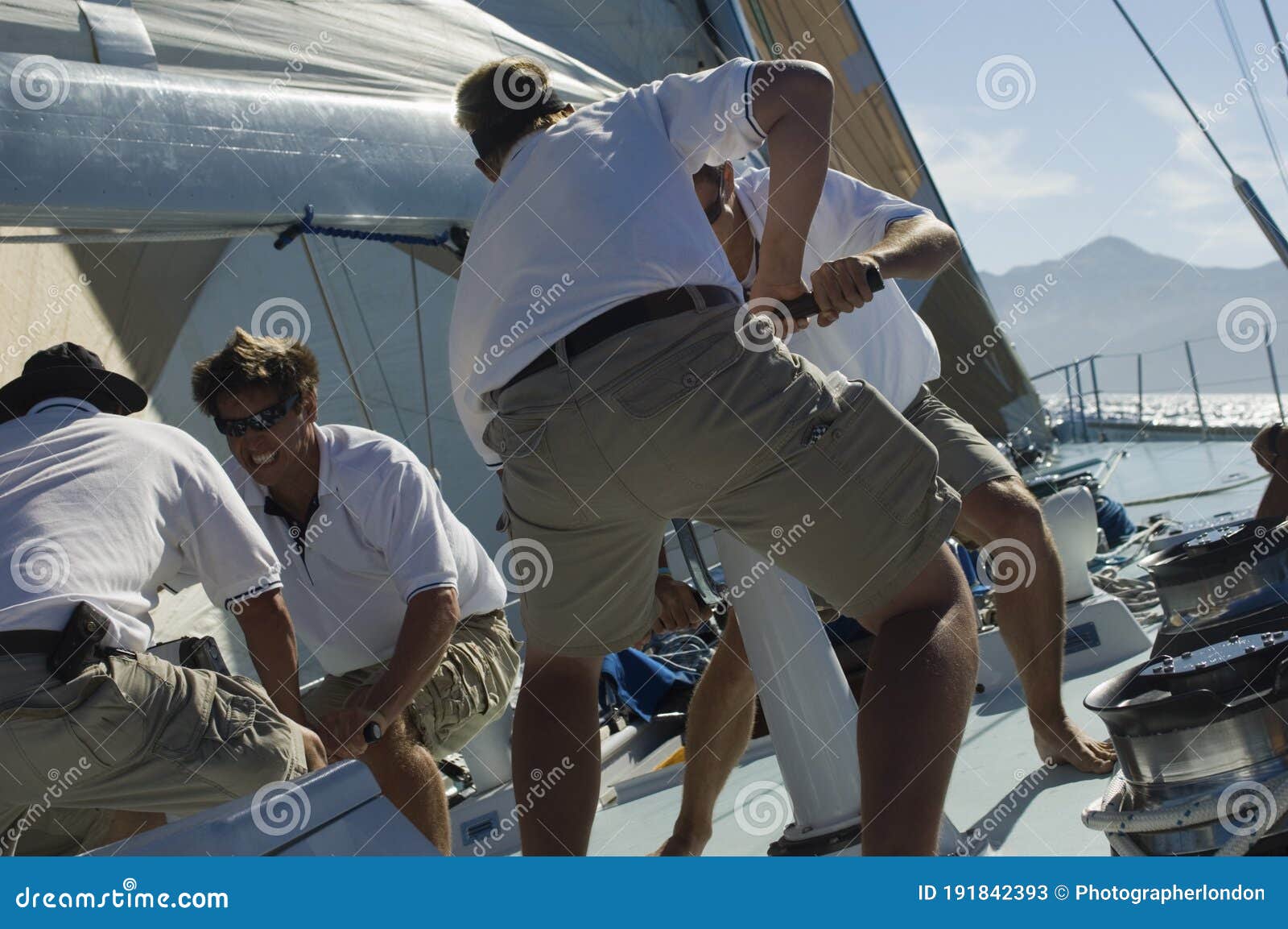 Sailors Working on Windlass on Yacht Stock Image - Image of urgency ...