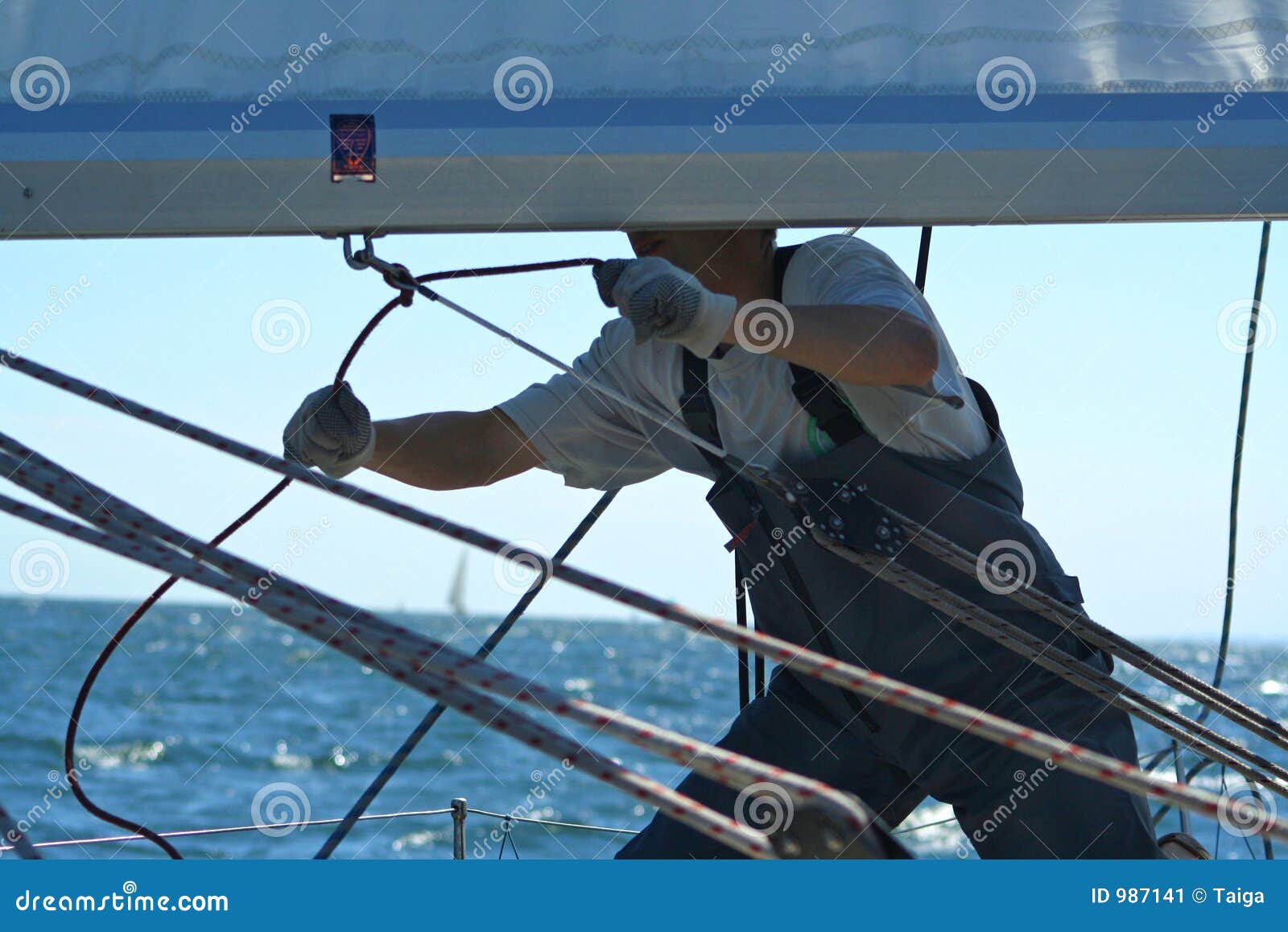 Sails is a man s work stock image. Image of craft, clear - 987141