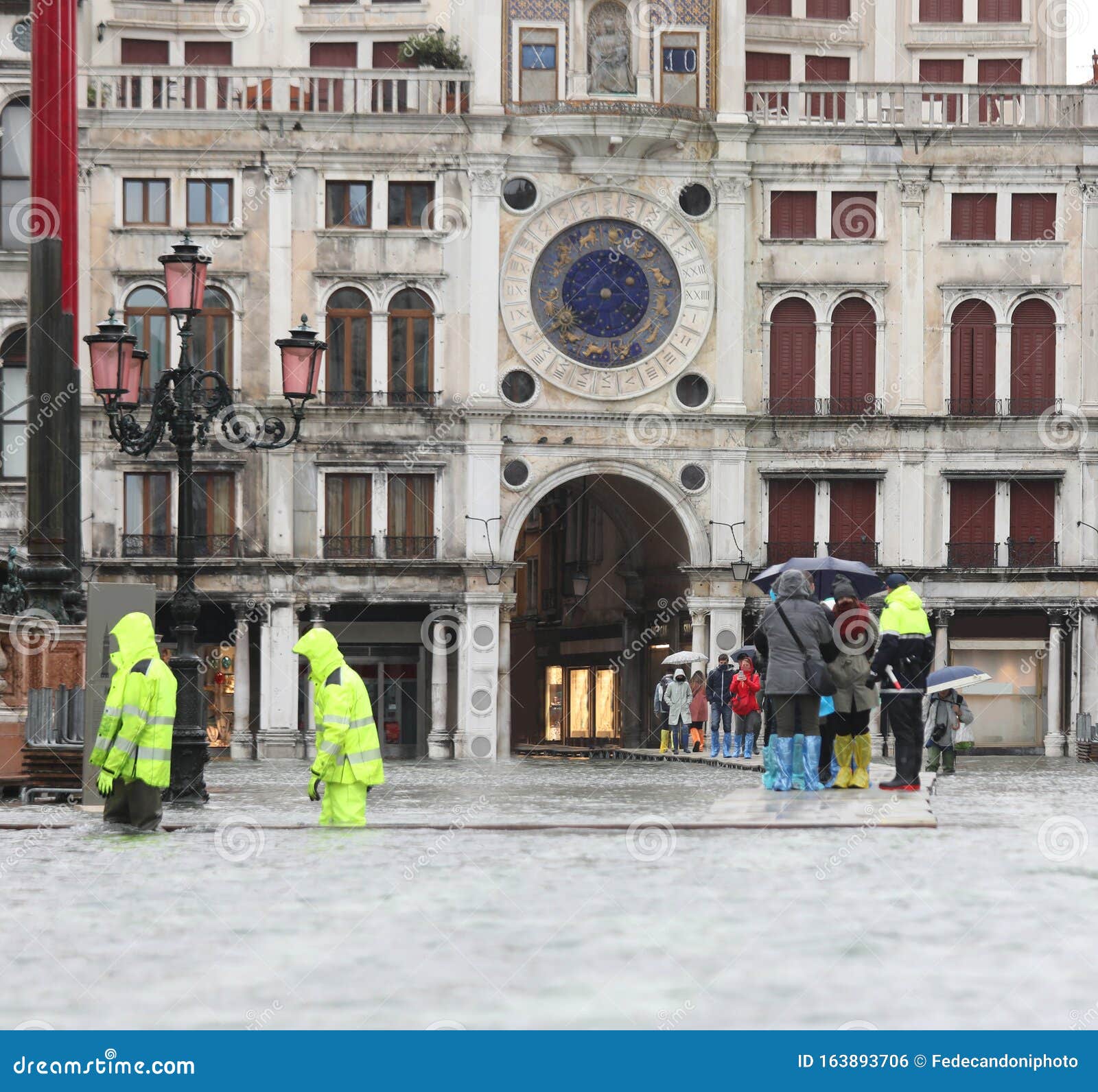 Saint Mark Square in Venice during the Tide and the Clock Tower ...