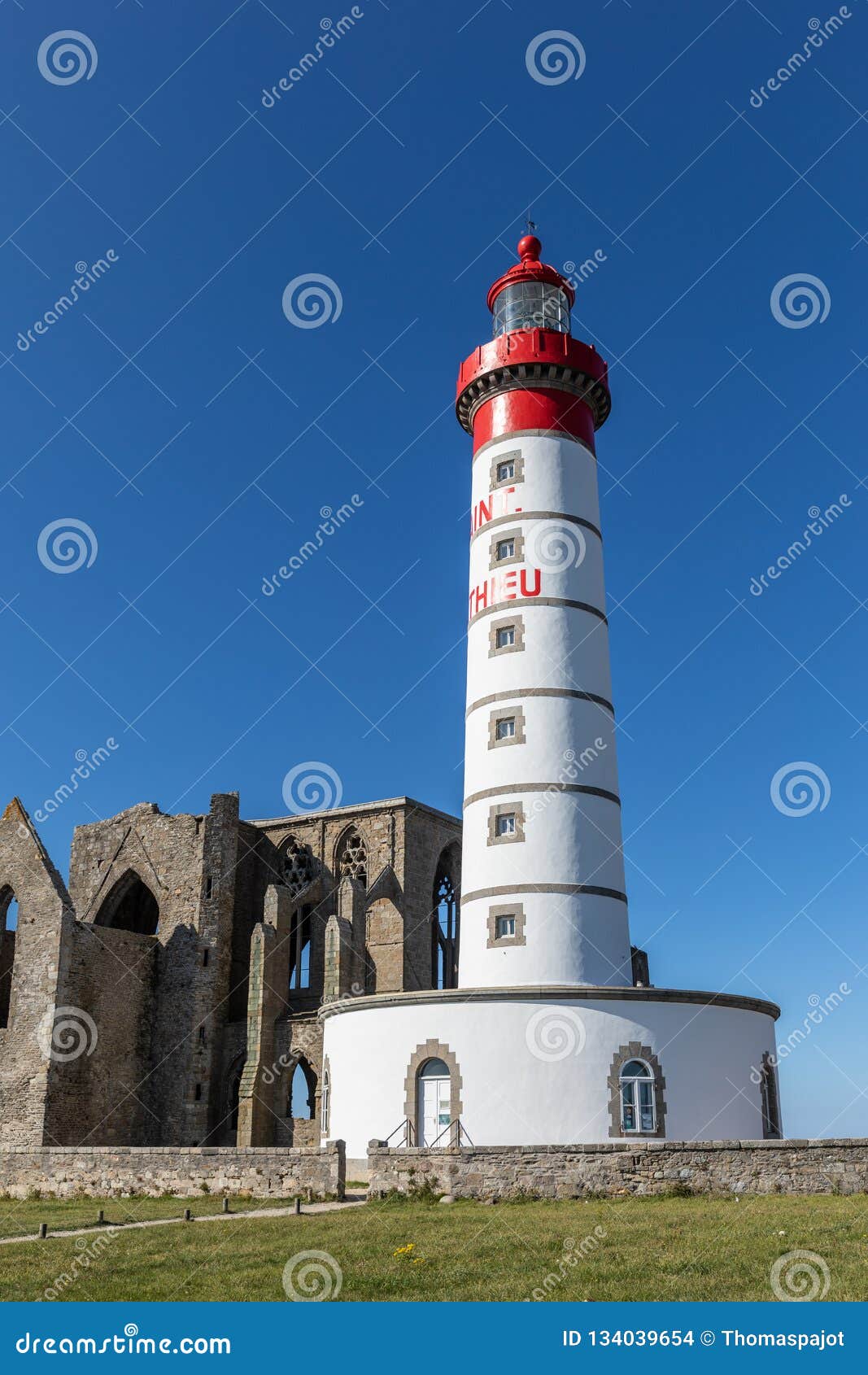 The Saint-Mathieu Lighthouse with the Ruins of the Abbey Stock Photo ...