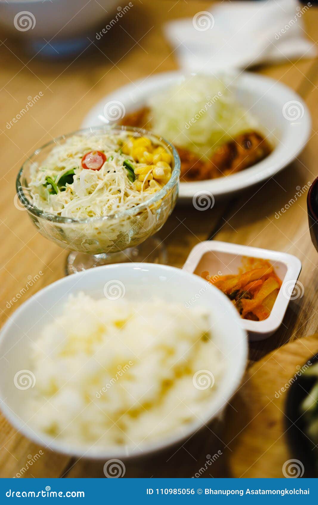 Salad with Bowl of Rice and Gyoza Stock Photo - Image of crockery ...