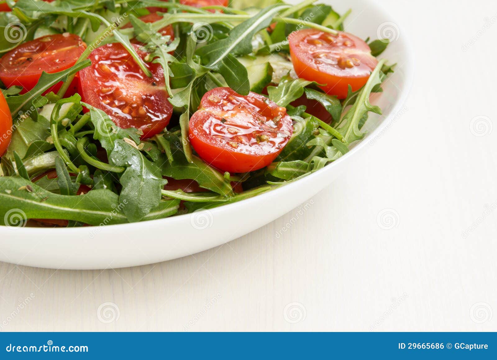 Salad from Ruccola, Cherry Tomatoes and Cucumber Stock Photo - Image of ...