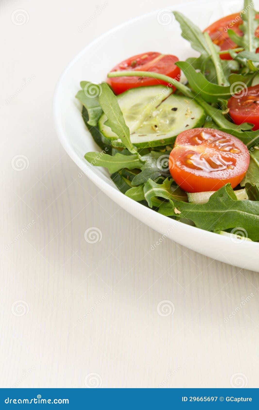 Salad from Ruccola, Cherry Tomatoes and Cucumber Stock Image - Image of ...