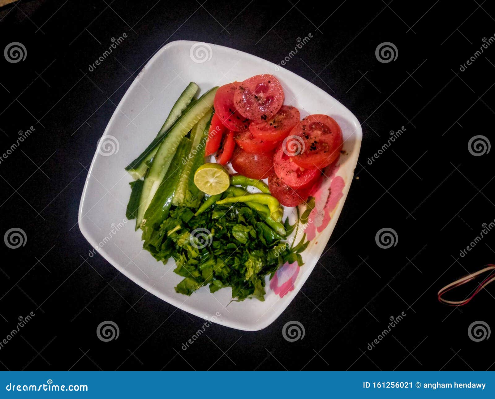 Salad of Tomatoes, Cucumber, Pepper , Lemon and Rocca Stock Image ...