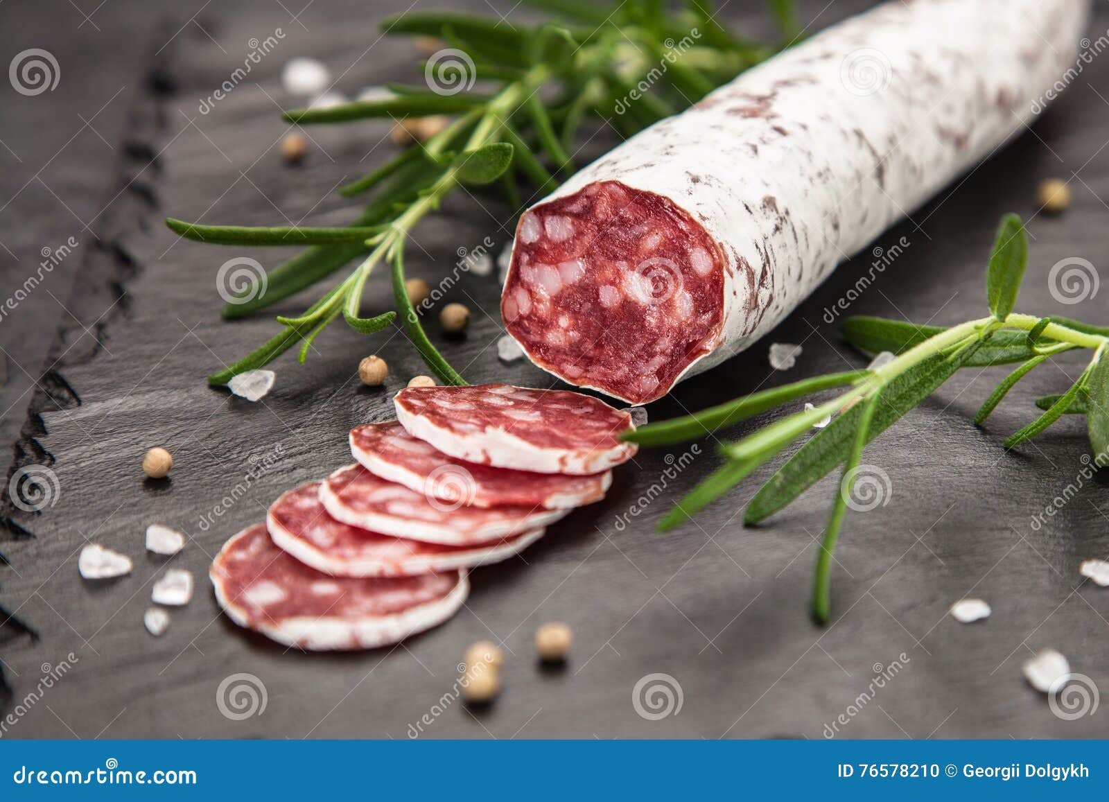Salami on dark background stock photo. Image of platter - 76578210