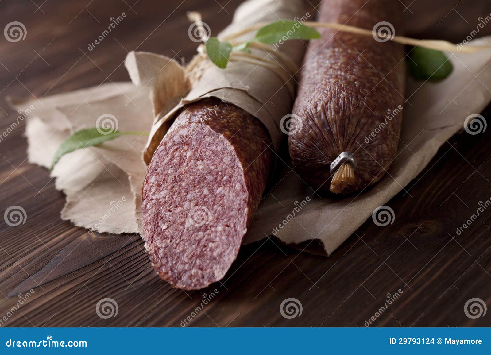 Salami on wooden and paper stock photo. Image of dried - 29793124