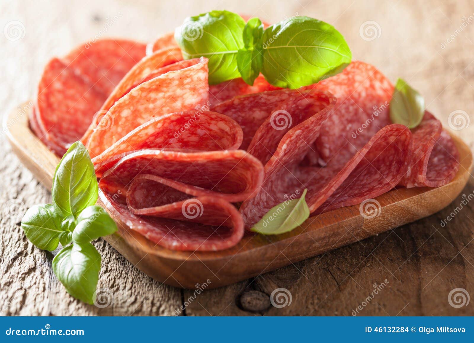 Salami Slices in Wooden Plate Stock Photo - Image of slice, dinner ...