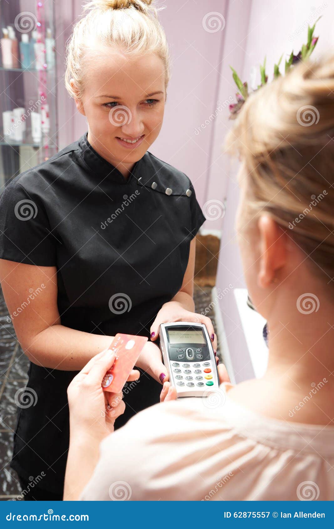 Sales Assistant Accepting Card Payment from Customer Stock Image ...
