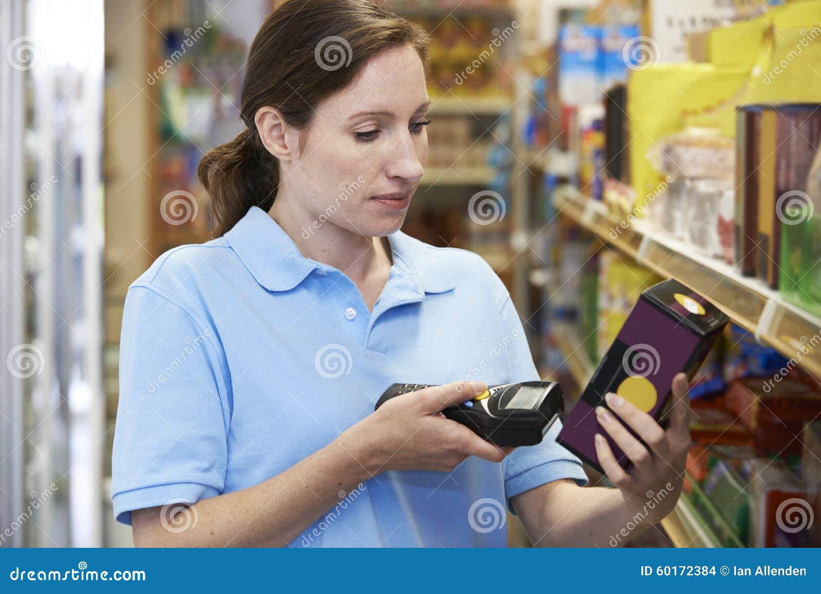Sales Assistant Checking Stock Levels in Supmarket Using Hand he Stock ...