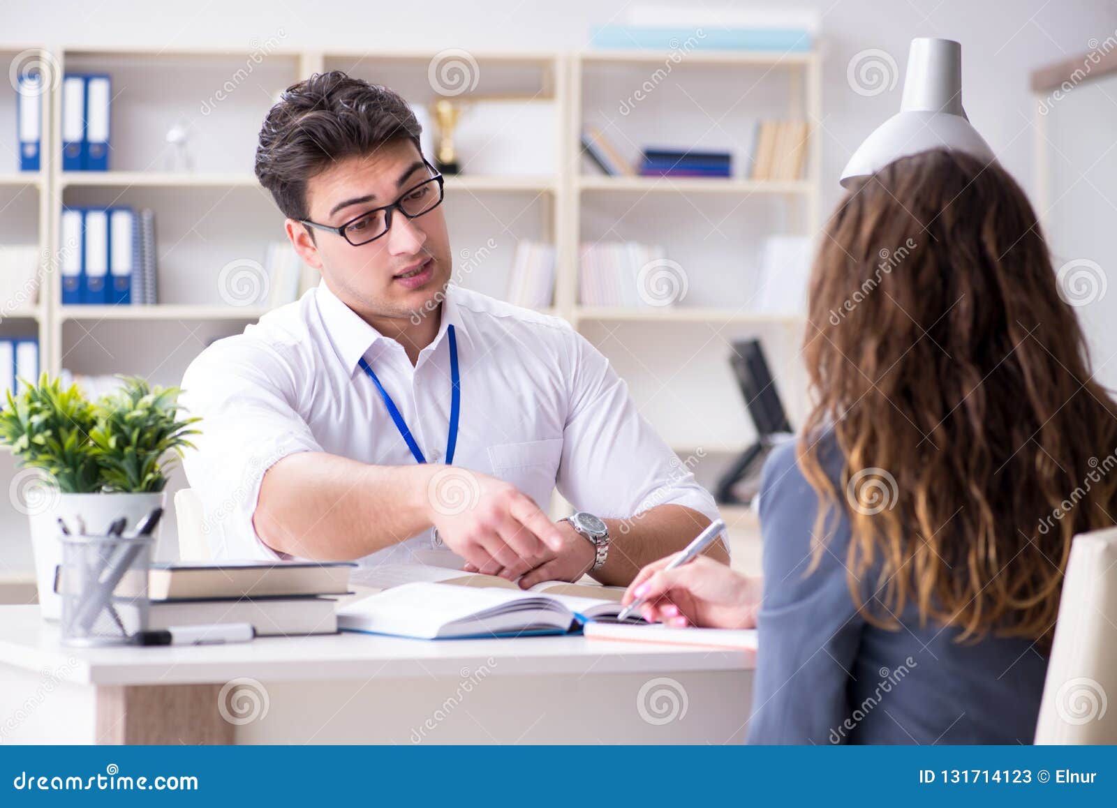 The Sales Assistant Discussing Transaction with Customer Stock Image ...