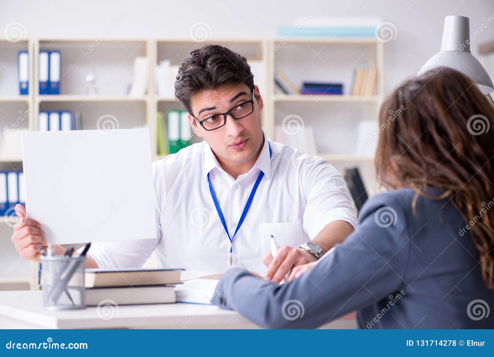 The Sales Assistant Discussing Transaction with Customer Stock Photo ...