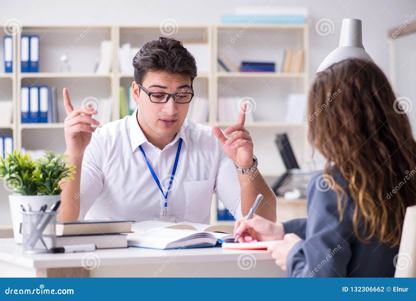 The Sales Assistant Discussing Transaction with Customer Stock Photo ...