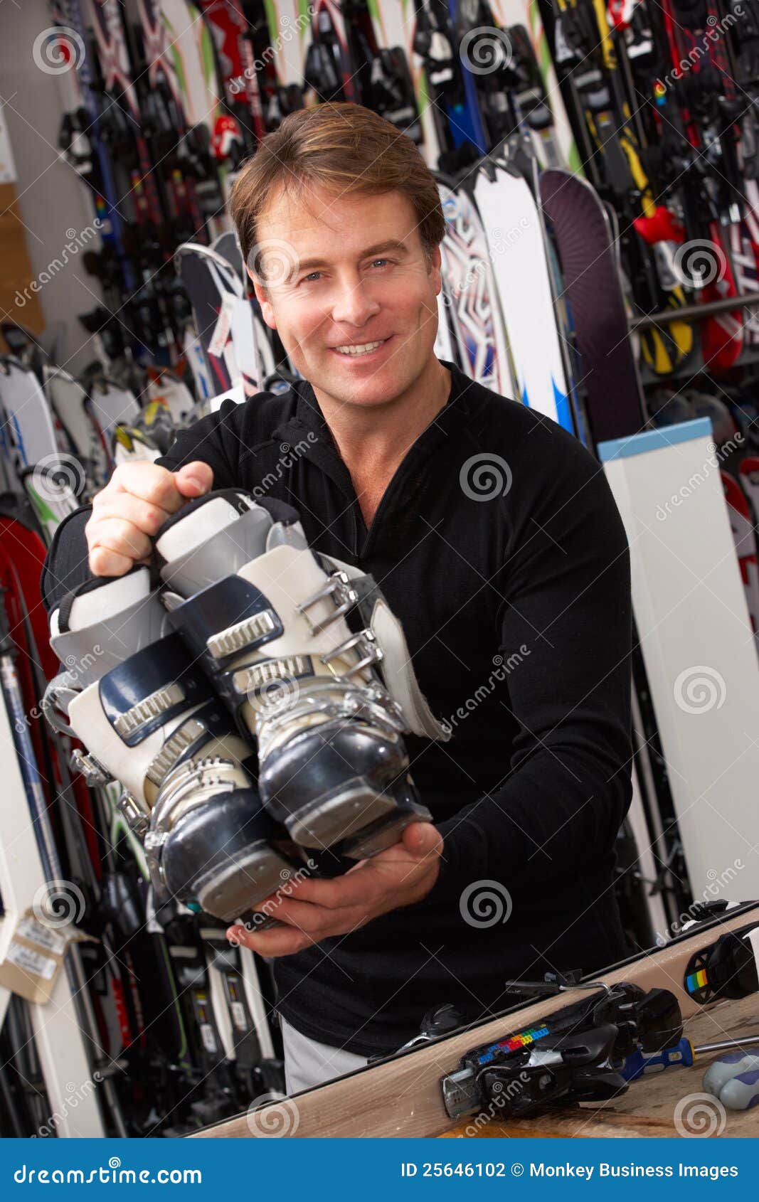 Sales Assistant with Ski Boots in Hire Shop Stock Photo - Image of ...